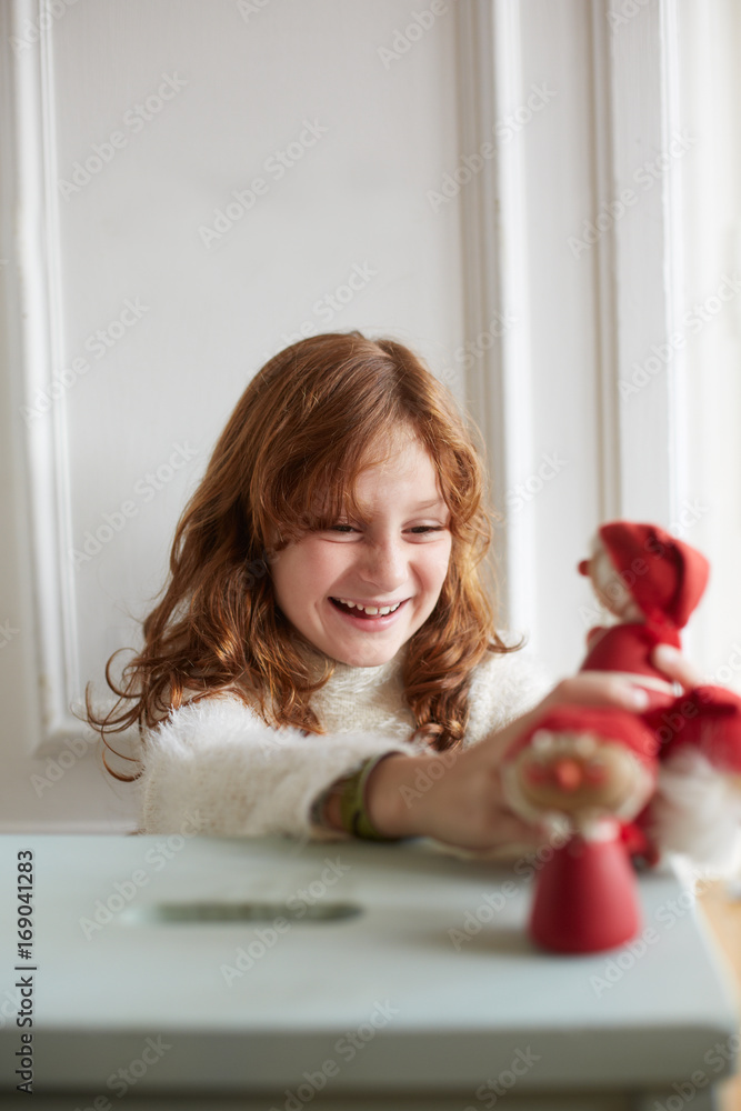 Little girl playing with figures of christmas dwarfs Stock Photo ...