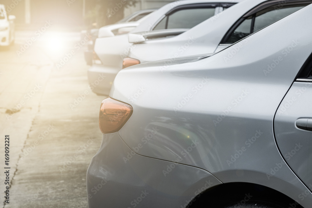 Crowded parking lot, car rear end in parking lot. Stock Photo | Adobe Stock