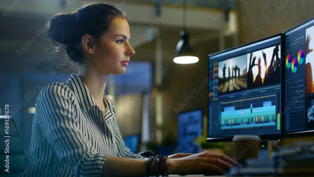 Vidéo Stock Female Video Editor Works with Footage and Sound on Her ...