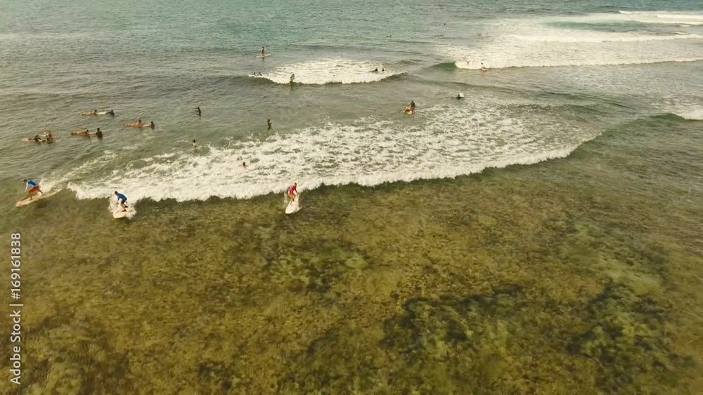 Surfers at siargao islands famous surf break cloud 9 near mindanao the ...