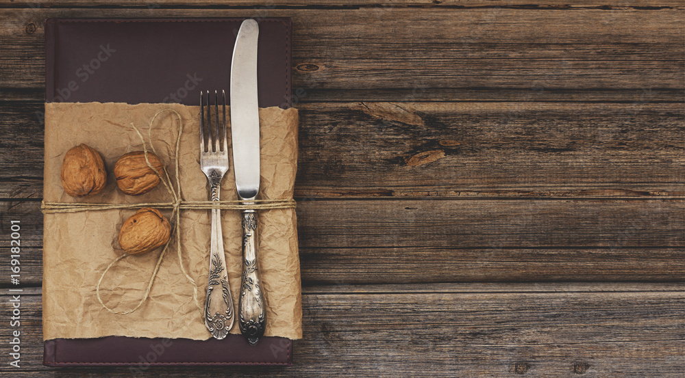 Vintage leather restaurant or cafe food menu with silverware or cutlery ...