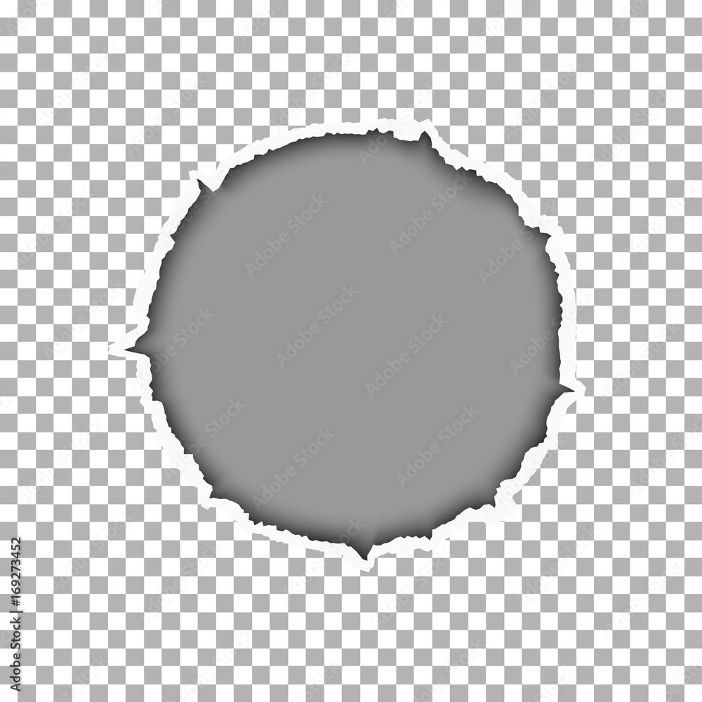 Ragged round hole in transparent sheet of paper and gray backdrop of ...