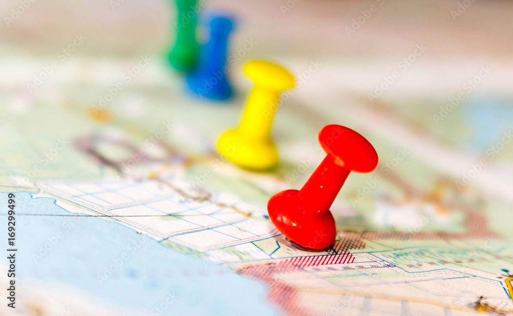 Travel destination points on a map indicated with colorful thumbtacks ...