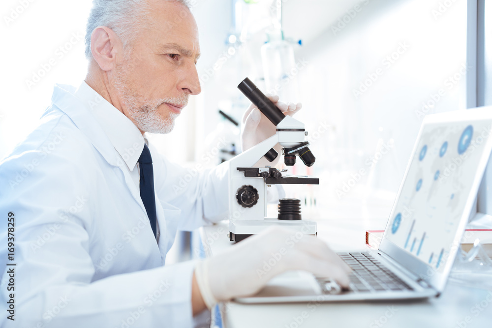 Profile picture of attentive researcher that analyzing diagram Stock ...