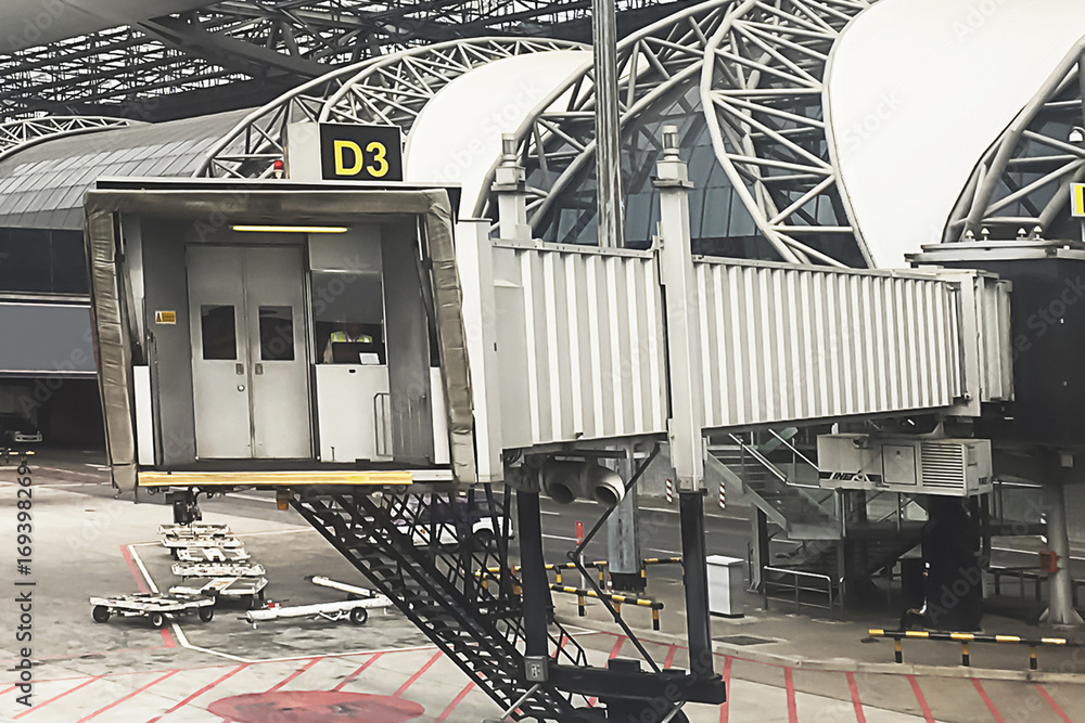 The Tunnel of the jet bridge connected to the aircraft for loading ...