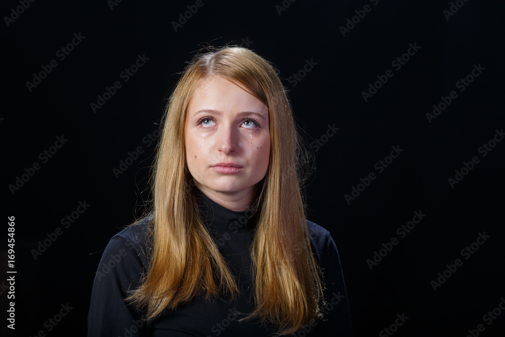 Sad young girl blonde hair crying Stock Photo | Adobe Stock