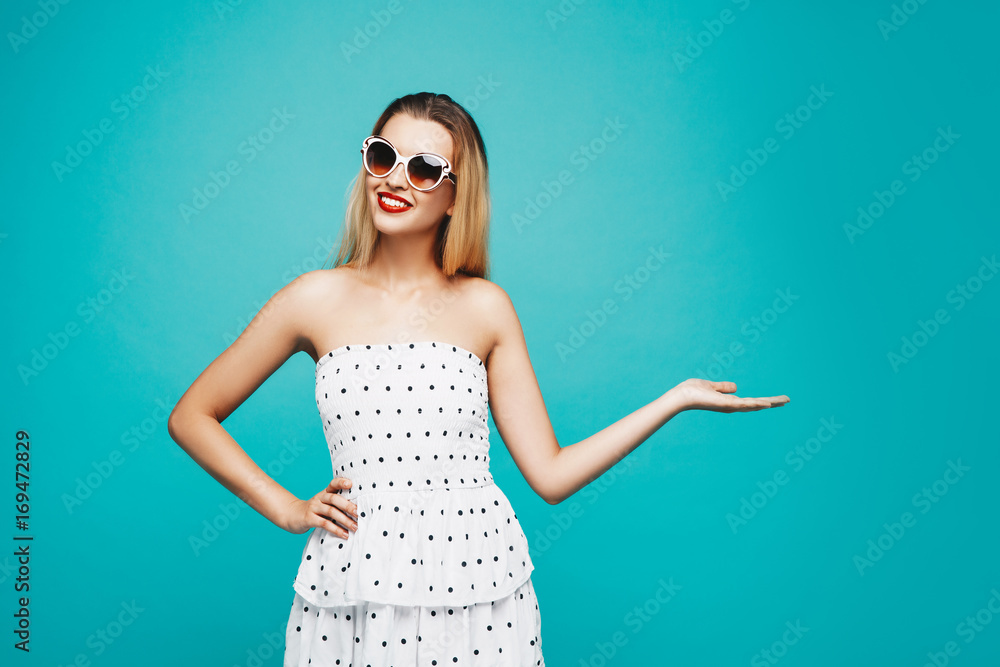 Summer model portrait. Dressed well stylish girl on sunglasses on blue ...