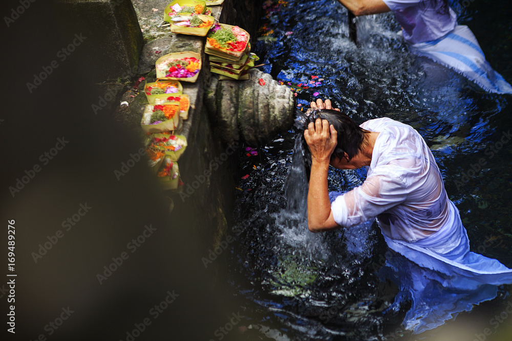 Prayer at Tirta Empul Temple Bali Stock Photo | Adobe Stock