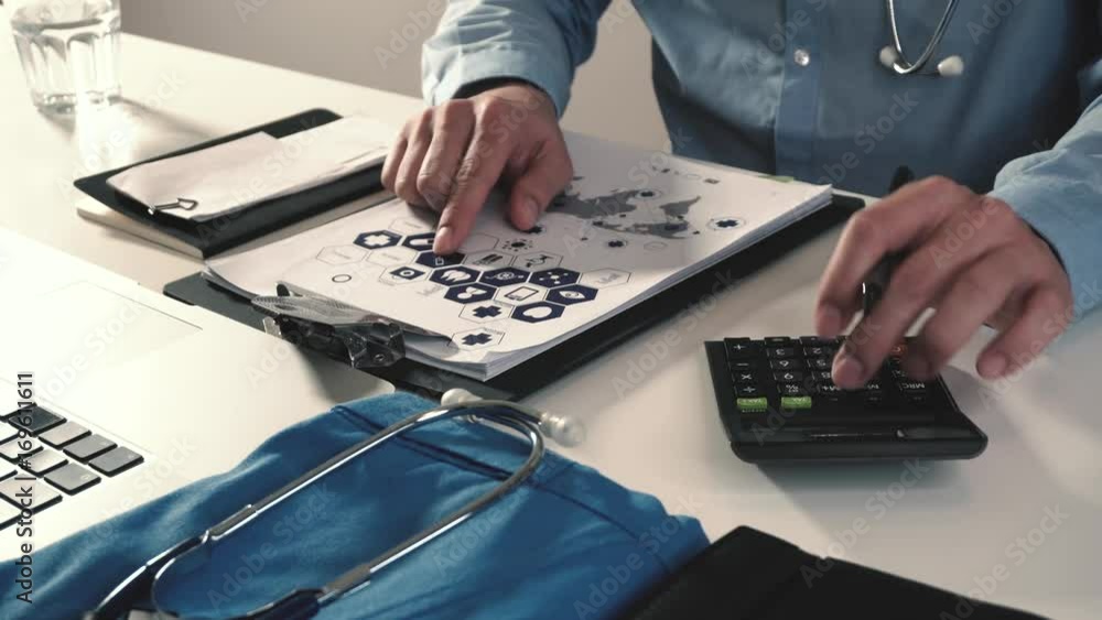 Healthcare costs and fees concept.Hand of smart doctor used a ...