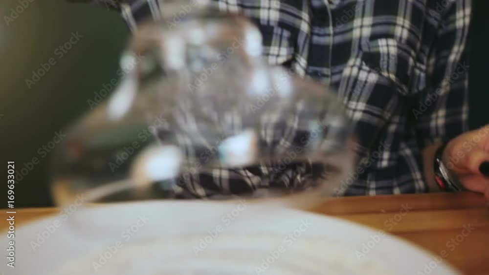 Bar cocktail drinks concept - closeup of glass dipping in salt after ...