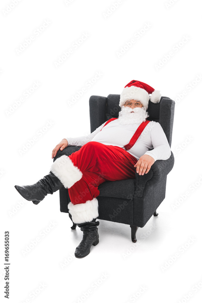santa claus sitting in armchair Stock Photo | Adobe Stock
