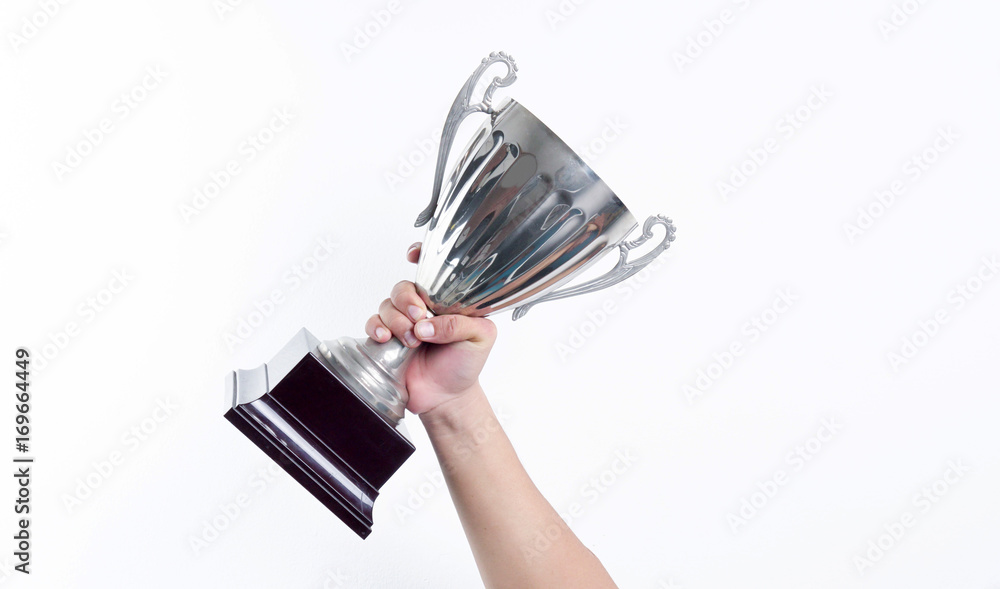 hand holding up a trophy cup as a winner in a competition Stock Photo ...