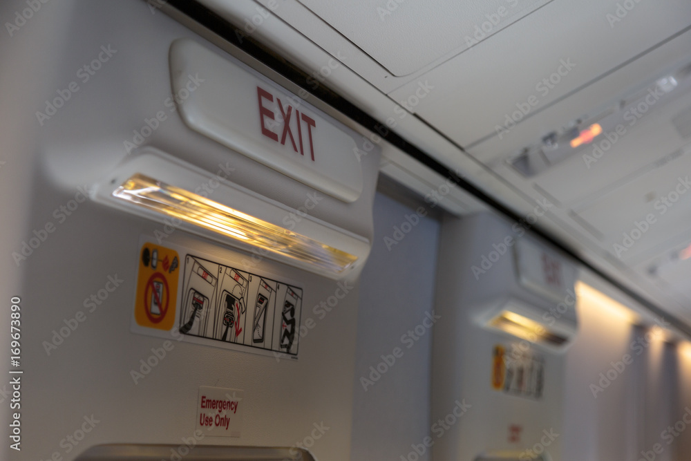 Emergency Exit and Light in Aircraft Cabin Stock Photo | Adobe Stock