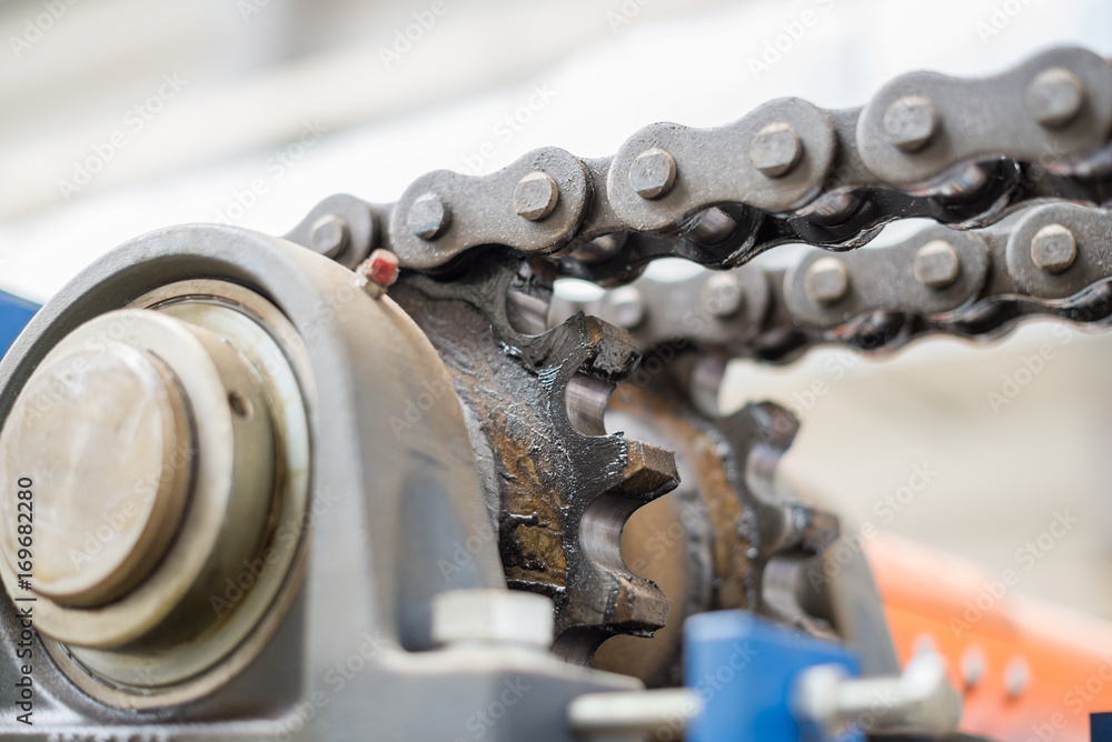 The mechanism of the chain transmission. Bearing, drive shaft, gear and ...