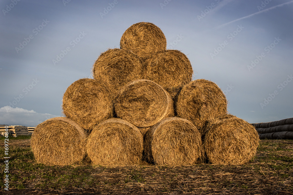 Triangle pyramid from pressed bales of straw reels Stock Photo | Adobe ...