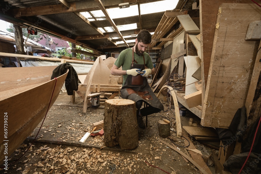 Carpenter shaping wood in workshop Stock Photo | Adobe Stock