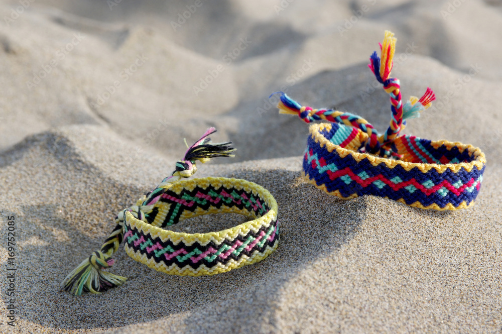 Natural bracelets of friendship in a row, colorful woven friendship ...