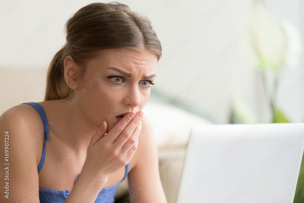 Upset Young Woman Looking On Laptop Screen With Fear Lady With Worried