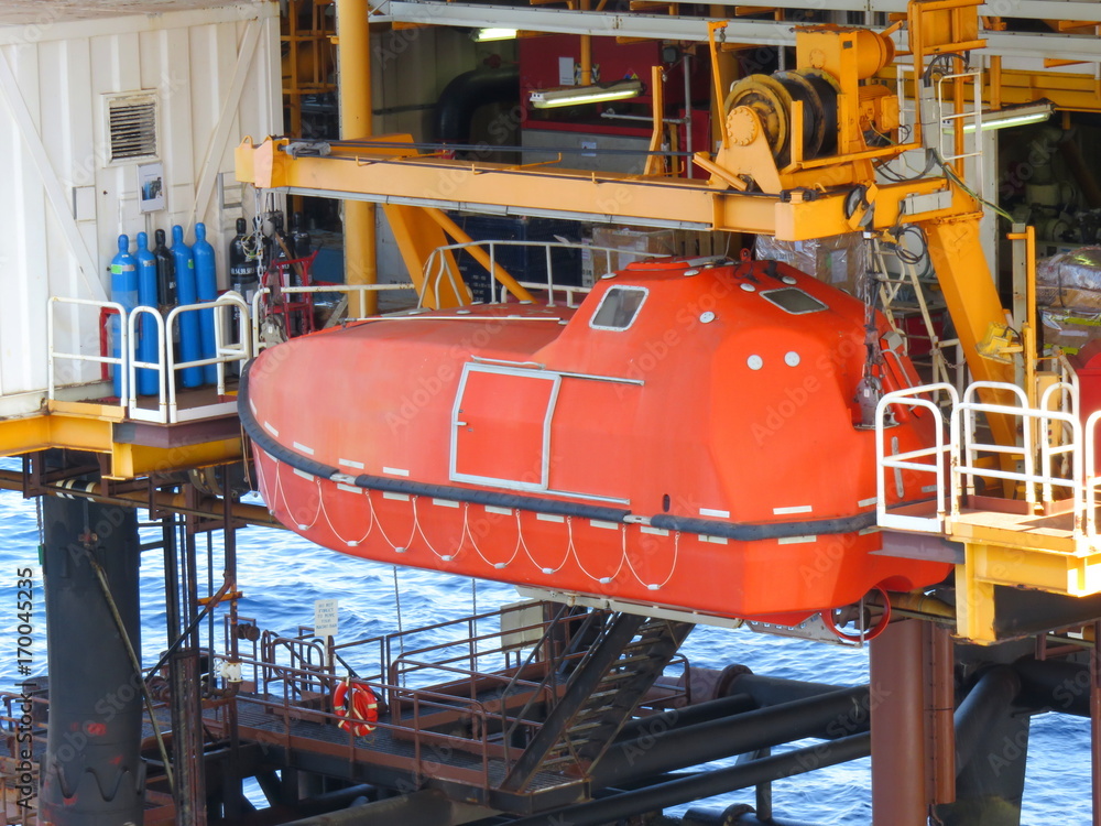Life boat or survival craft at muster station of oil and gas drilling ...