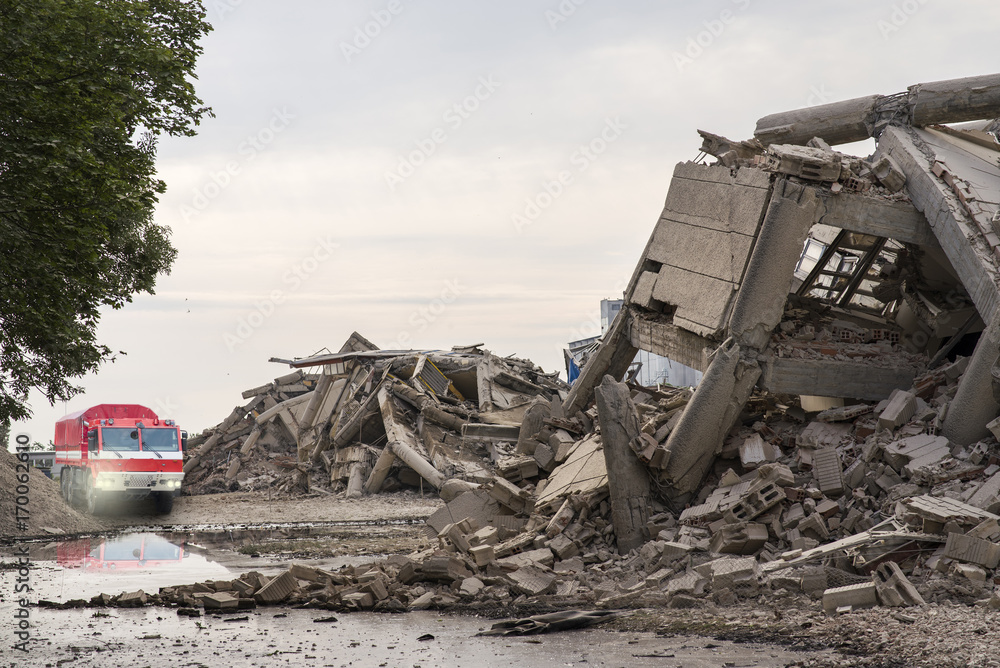 Fire brigade car among collapsed concrete buildings Stock Photo | Adobe ...