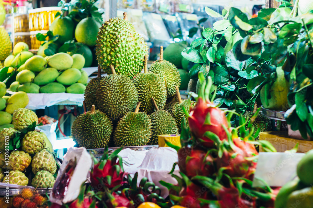 Mango, dragon fruit, durian and oranges on a fresh fruit stall at the ...