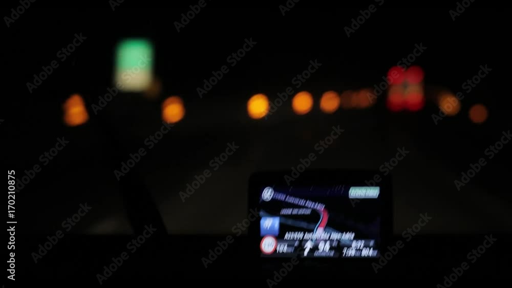 Vidéo Stock GPS navigation in car driving at night at blurry lights ...