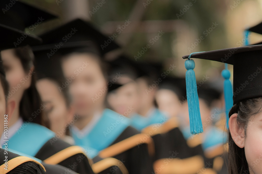 Graduates in commencement graduation ceremony row, metaphor education ...