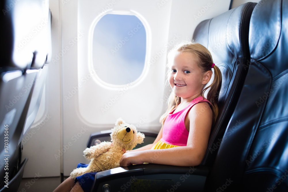 Child in airplane. Flight with kids. Family flying. Stock Photo | Adobe ...