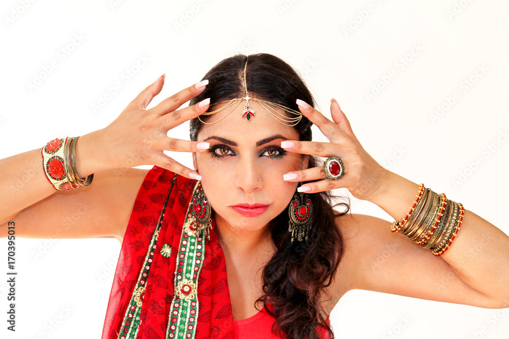 Woman dancing Indian dance in national dress. A handsome beautiful girl ...