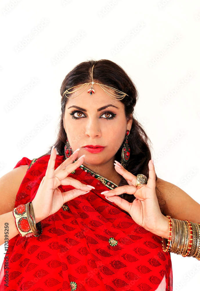 Woman dancing Indian dance in national dress. A handsome beautiful girl ...