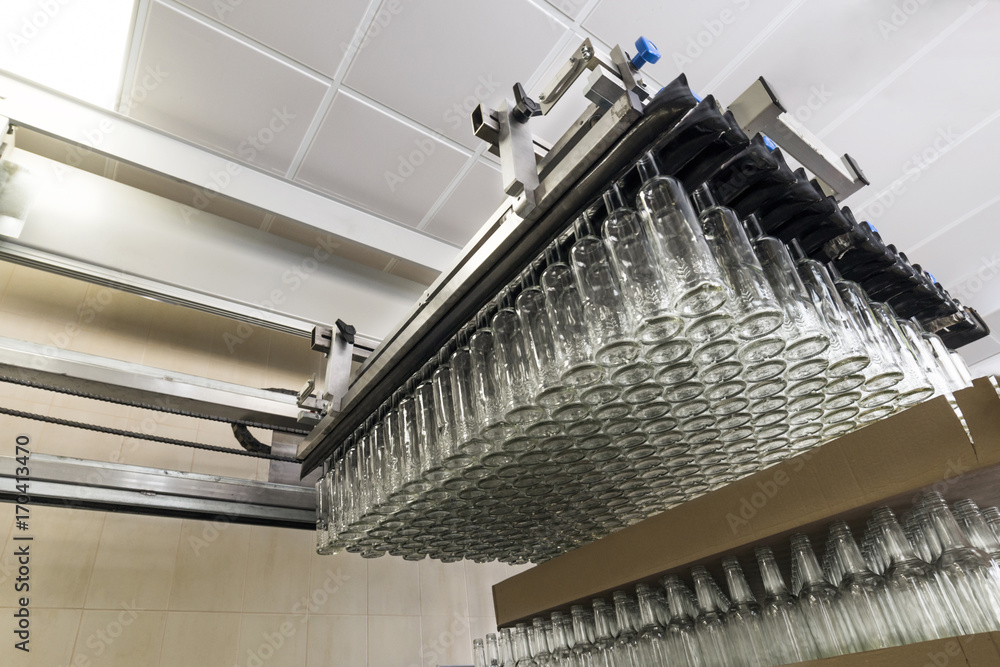 Unloading of glass bottles from pallets. Stock Photo | Adobe Stock