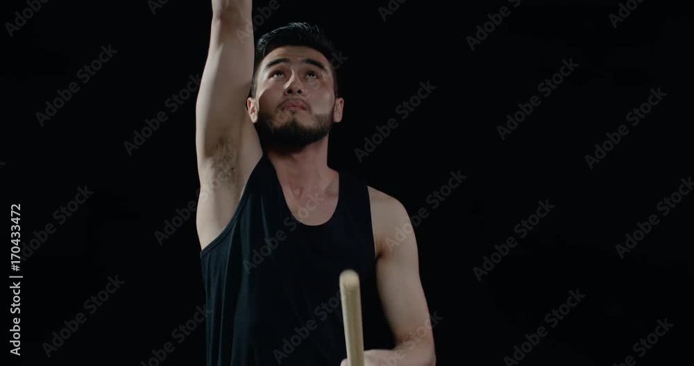 performance of Taiko , close-up Asian male drummer in black clothes ...