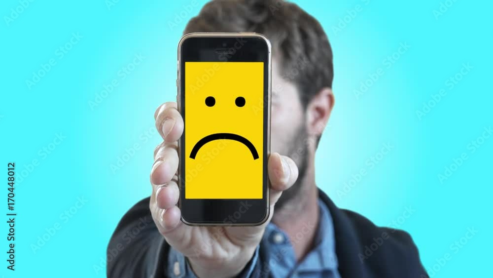 Man Shows Sadness Through Smartphone. Man shows his feelings through a ...