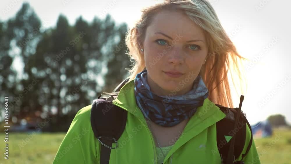 portrait of a beautiful paraglider girl, blonde with blue eyes. He ...