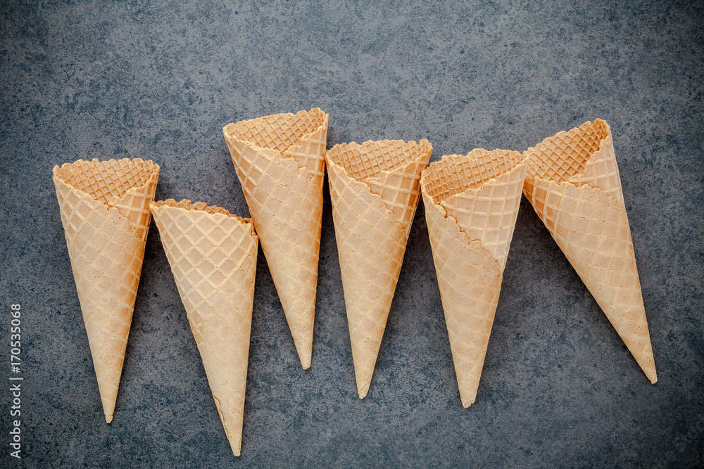Flat lay ice cream cones collection on dark stone background . Blank ...