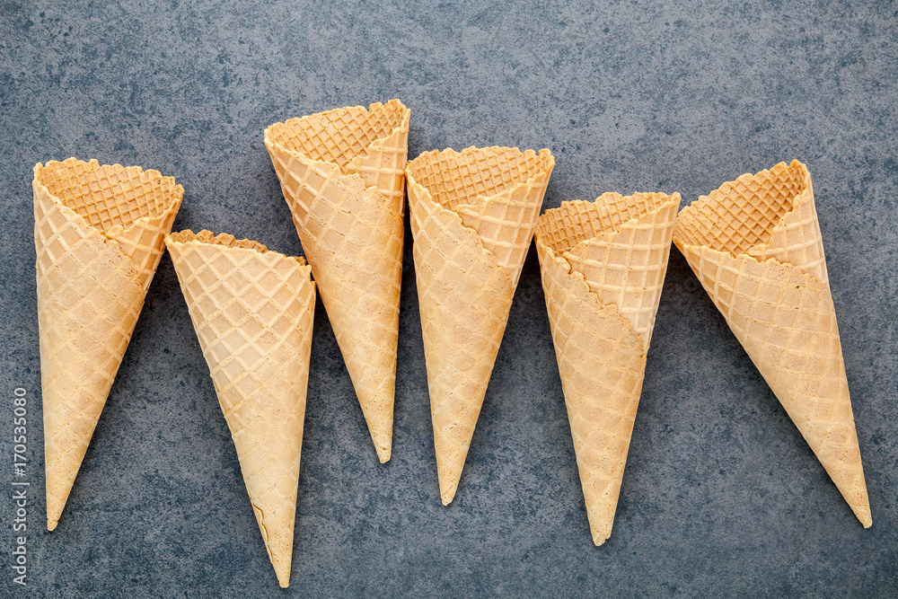 Flat lay ice cream cones collection on dark stone background . Blank ...