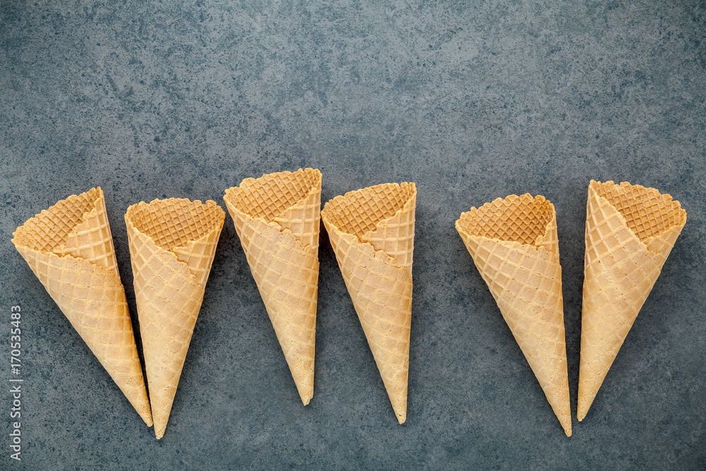 Flat lay ice cream cones collection on dark stone background . Blank ...