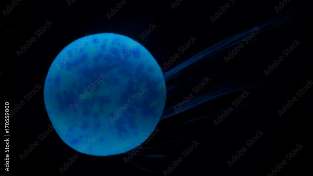 Macro of hypnotic effect of blue pill dissolved in water with ...