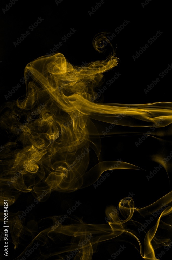 Gold smoke on black background,movement of gold smoke, Abstract gold ...