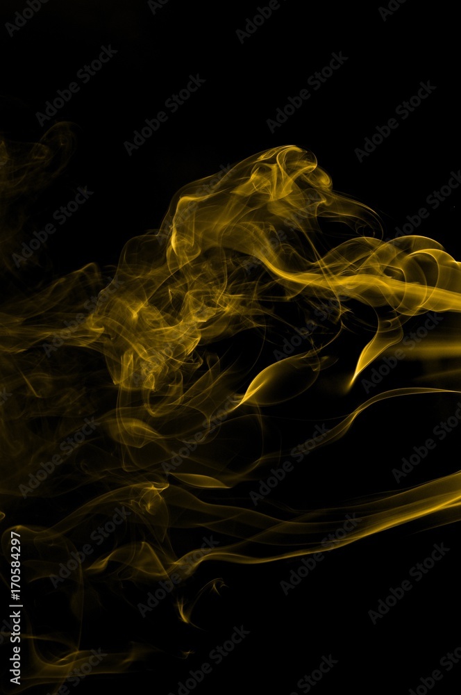 Gold smoke on black background,movement of gold smoke, Abstract gold ...