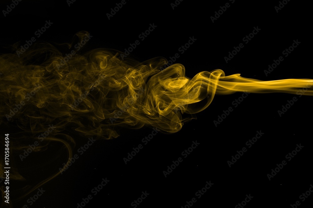 Gold smoke on black background,movement of gold smoke, Abstract gold ...