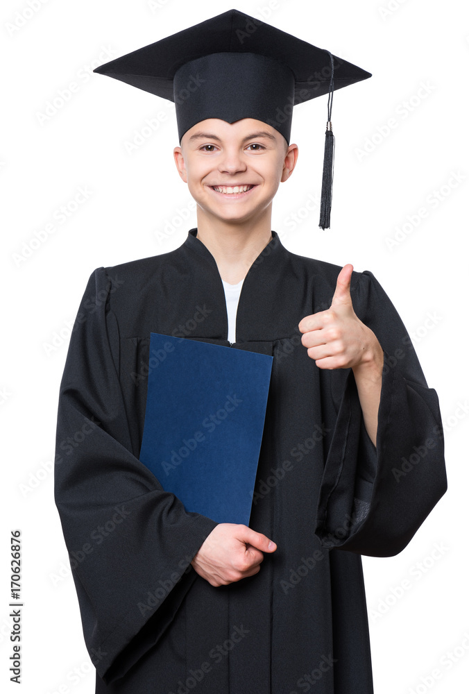 Graduate teen boy student in black graduation gown with hat, holding ...