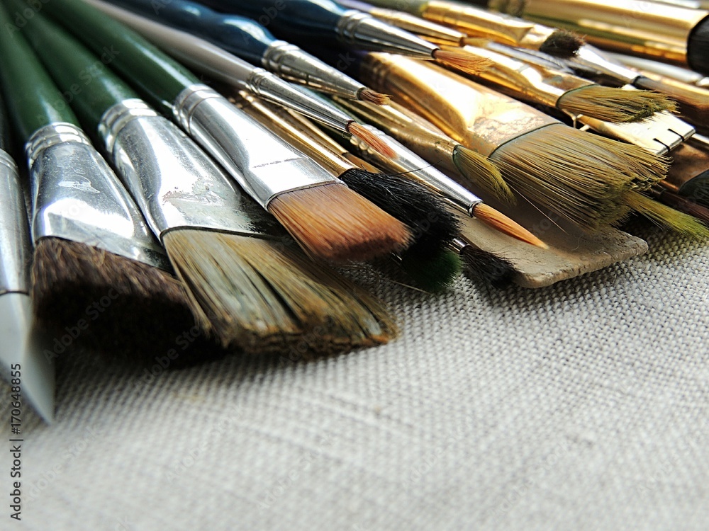 Big variety of brushes, tools for painting and sculpture on linen ...