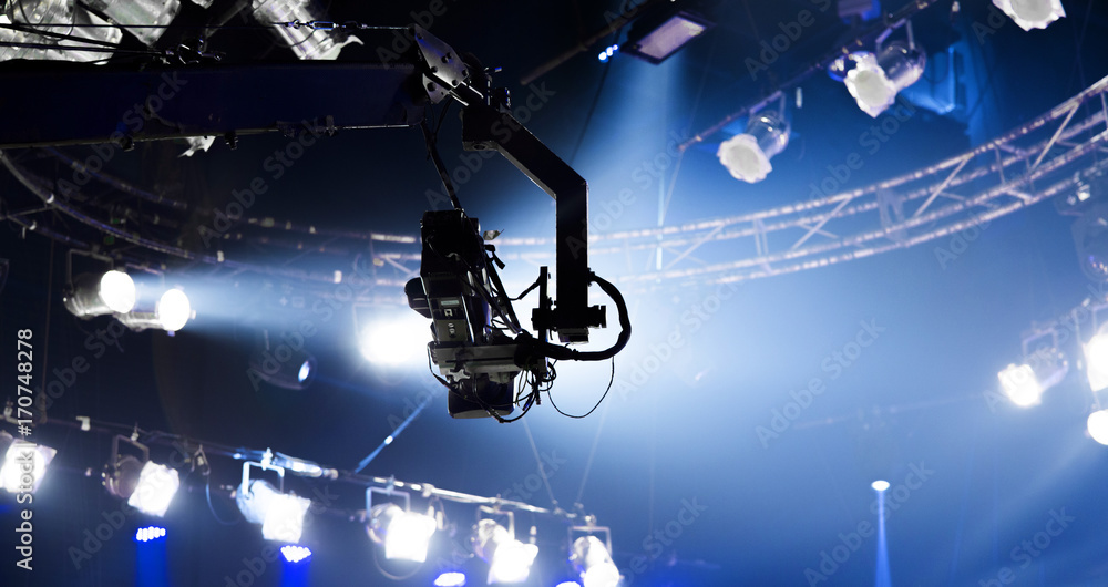 camera record on crane on stage concert cinema gameshow or ...