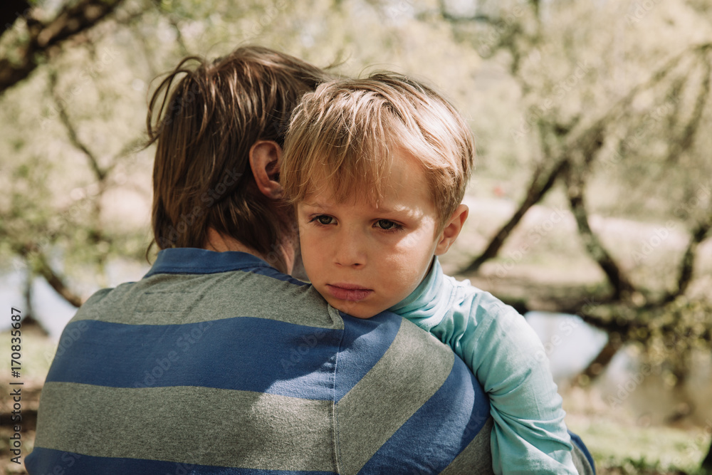 Sad crying son hugging father Stock Photo | Adobe Stock