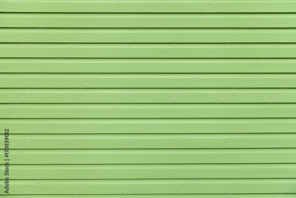Green vinyl wooden siding panel background with imitation wood texture ...