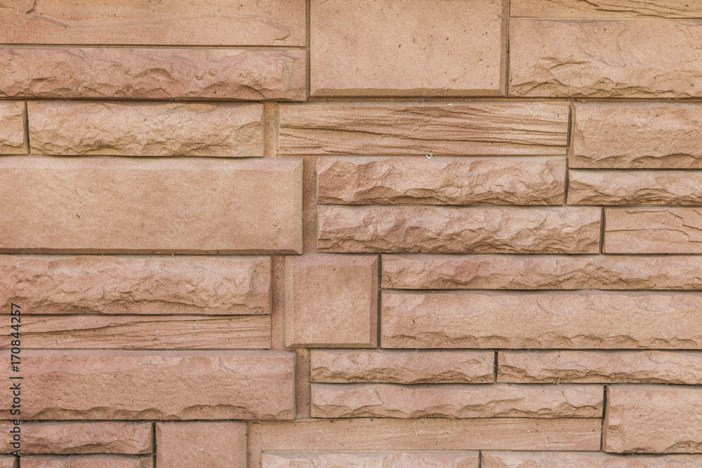 Stone wall brick texture background beige surface facade. Plstic ...