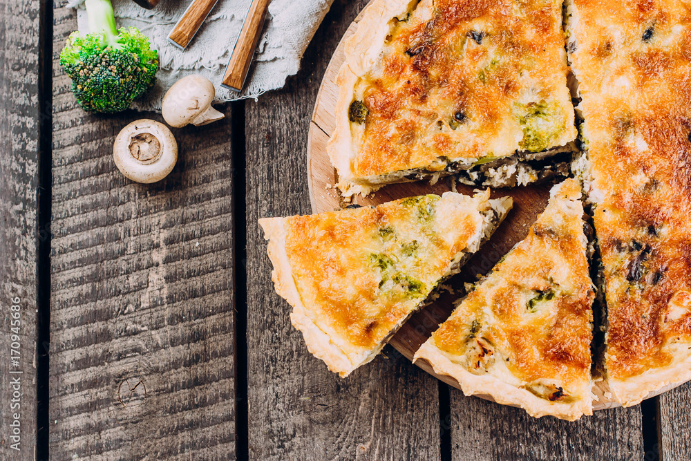 Quiche Lorraine with chicken and vegetables on rustic dark table ...