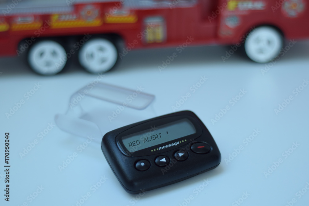 Red Alert on pager Stock Photo | Adobe Stock
