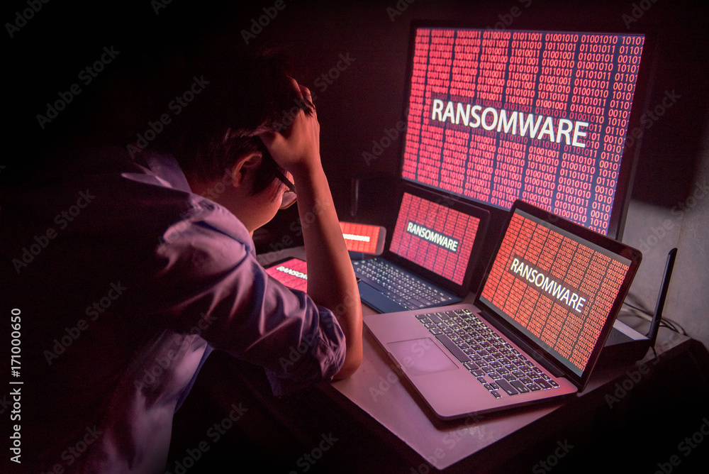 Young Asian male frustrated, confused and headache by ransomware attack ...